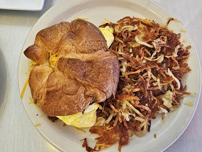 A breakfast sandwich that requires both hands and possibly a bib &ndash; croissants weren't meant to contain this much deliciousness.