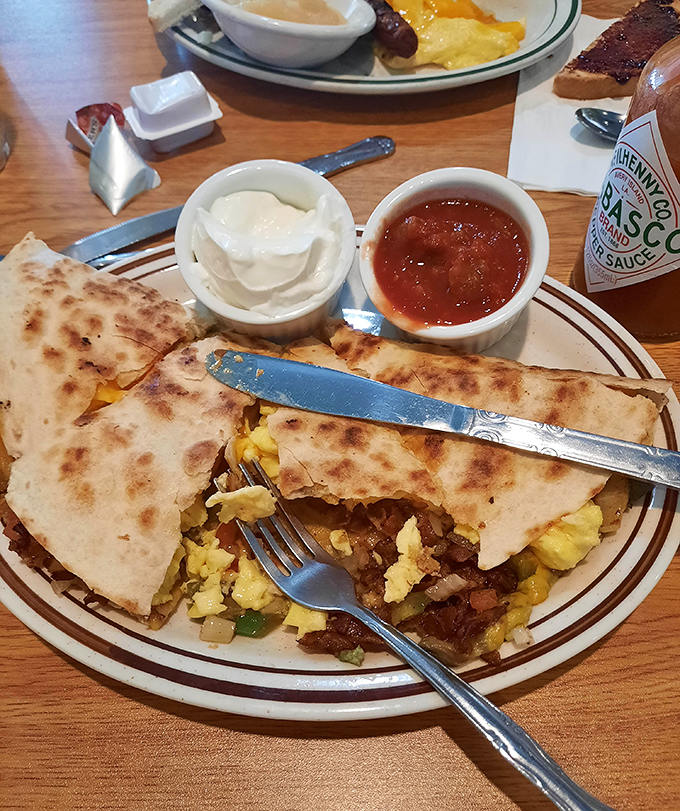 The breakfast quesadilla: where morning meets Mexico, creating the handheld miracle that makes forks entirely optional.