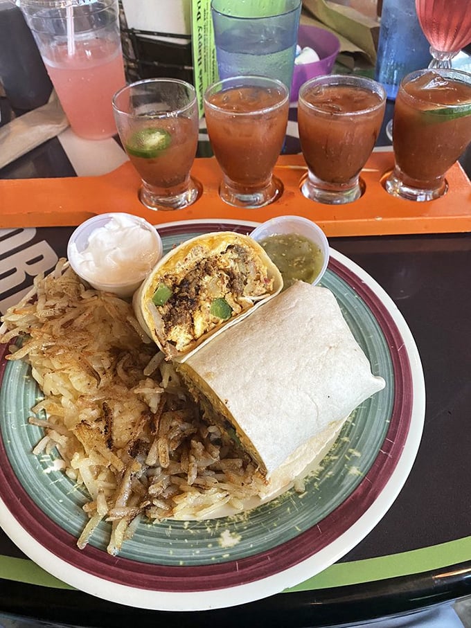 Breakfast burritos: where morning ingredients find their true calling wrapped in a tortilla blanket with hash browns standing guard on the side.