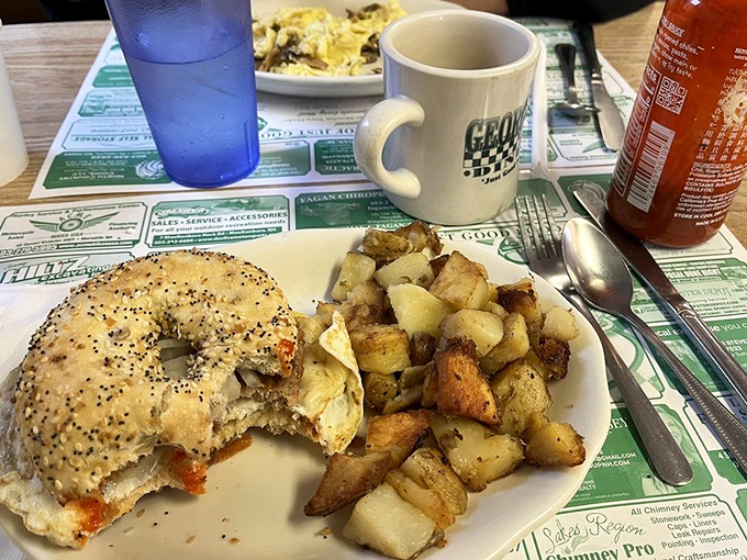 The breakfast sandwich and home fries combo that's launched a thousand productive days. That coffee mug says it all&mdash;this is George's territory.