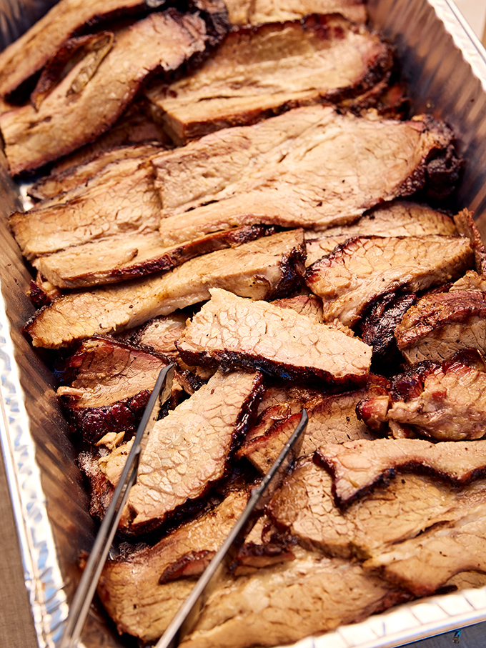 Sliced brisket that doesn't need a passport to transport you to Texas, complete with that telltale pink smoke ring that says "I took my time."