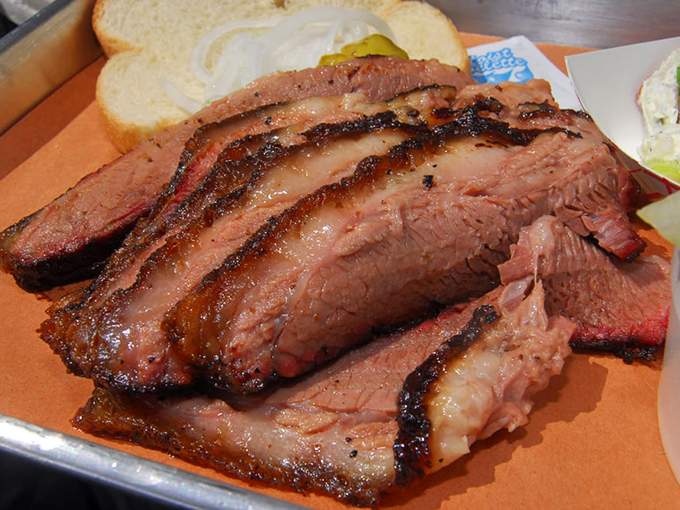 Brisket sliced thick enough to respect the craft, thin enough to appreciate the tenderness. That bark is the result of patience, not shortcuts.