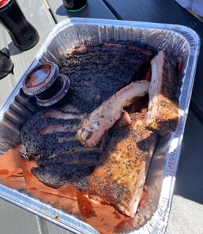 Brisket and ribs sharing a tray like old friends with stories to tell. The smoke ring is basically meat's way of showing off.