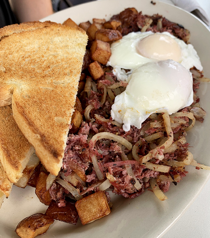 This corned beef hash with those perfectly runny eggs isn't just breakfast&mdash;it's edible therapy that costs less than a session with your therapist.