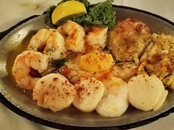 The broiled seafood platter that makes landlocked diners weep with joy. Plump scallops and shrimp seasoned with expertise that respects their ocean-fresh flavors.