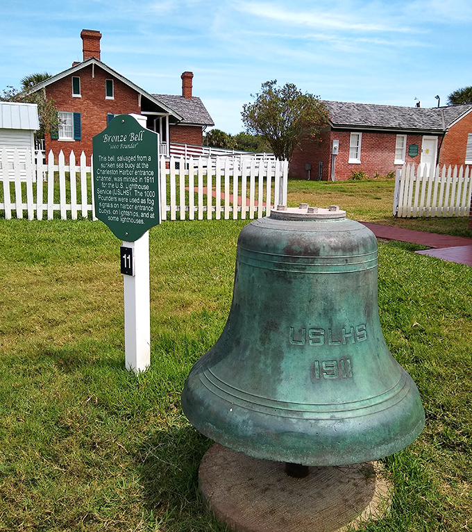 The bronze bell from 1901 still sits proudly on the grounds, a silent sentinel that once rang out warnings across the waves.
