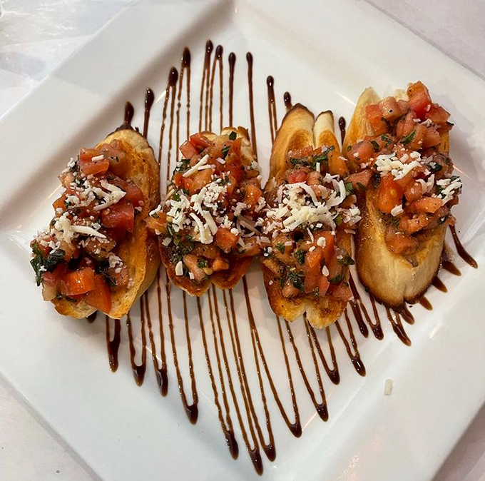 These bruschetta aren't just appetizers; they're tiny Italian flavor festivals topped with diced tomatoes, herbs, and a balsamic drizzle that zigzags like a delicious road map.