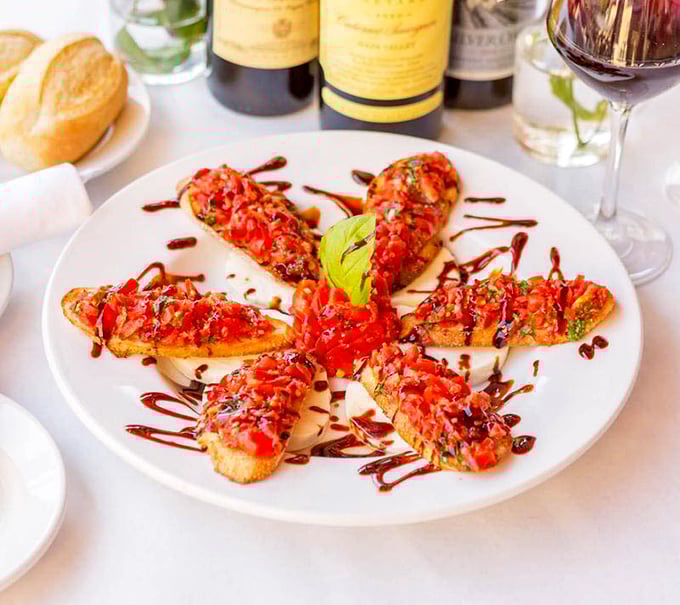 Bruschetta that demands to be photographed first&mdash;vibrant tomatoes on perfectly toasted bread with balsamic drizzle creating flavor fireworks in every bite.