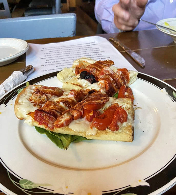 Bruschetta that would make an Italian grandmother nod in approval, topped with what appears to be a symphony of roasted tomatoes.