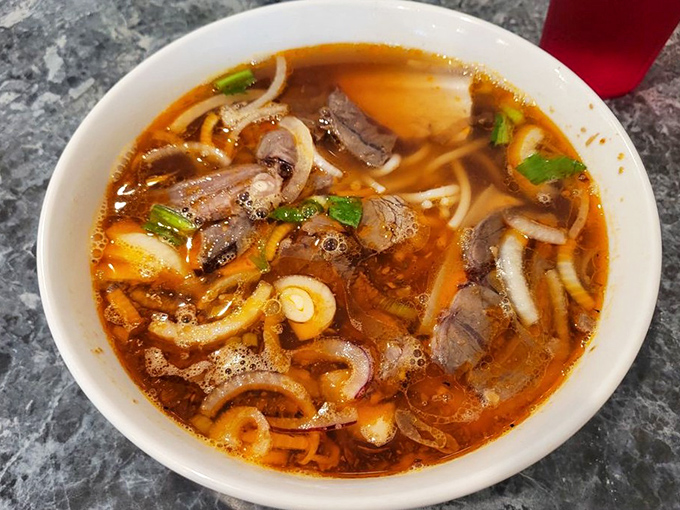 Bun bo hue brings the heat with its fiery broth &ndash; like a warm embrace that occasionally slaps you across the face, in the best possible way.