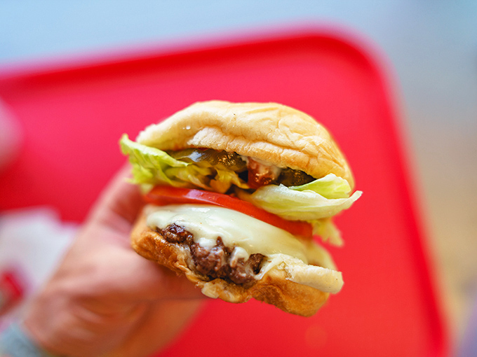 Behold the humble cheeseburger in its natural habitat&mdash;melty cheese, fresh veggies, and a perfectly grilled patty that puts fast food chains to shame.