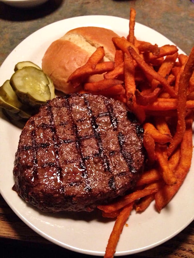 Grill marks like these don't happen by accident. This burger means business, with sweet potato fries that deserve their own fan club.