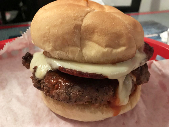 Behold the burger in its purest form—juicy, cheese-draped, and unapologetically delicious. No filter needed for this kind of food porn.