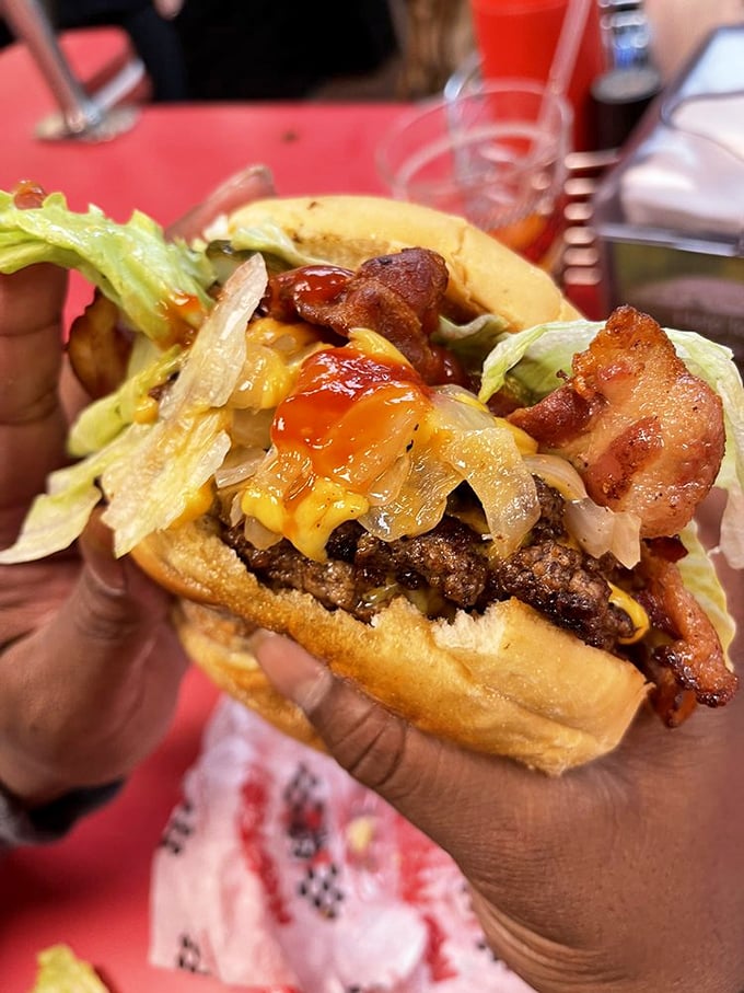 A burger that requires both hands and a strategy. The bacon is just showing off at this point.