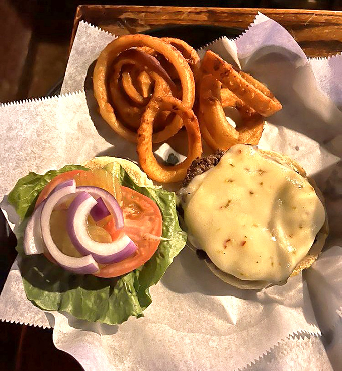A burger that doesn't need Instagram filters&mdash;just honest ingredients stacked high enough to require jaw exercises before attempting the first bite.