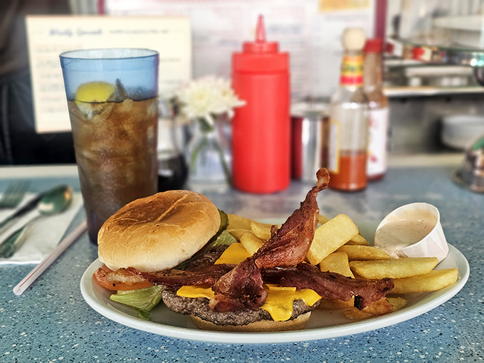 A burger that would make fast food chains hang their heads in shame. Those crispy bacon strips are practically doing a victory dance.