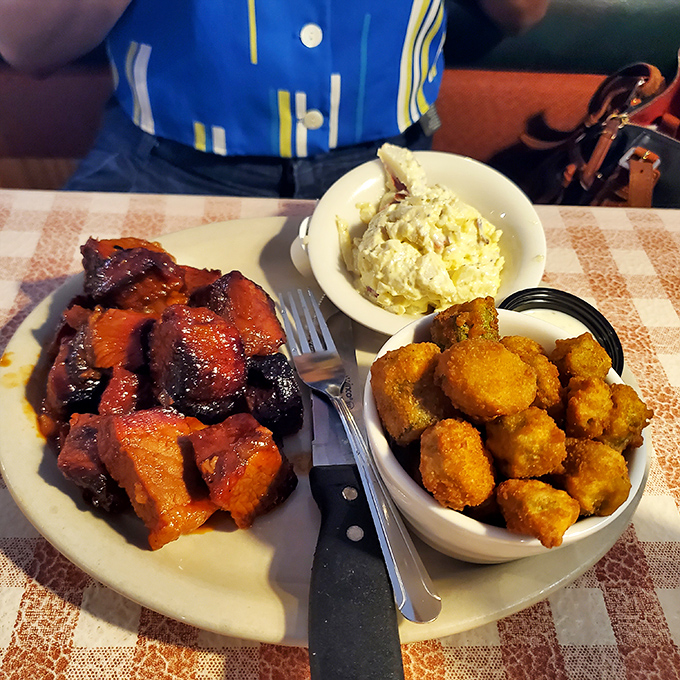 Burnt ends that glisten like mahogany gems, each one a perfect bite of caramelized bliss.