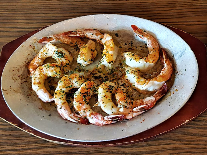 Butterfly shrimp arranged with the precision of a jewelry display. These aren't just cooked—they're respected.