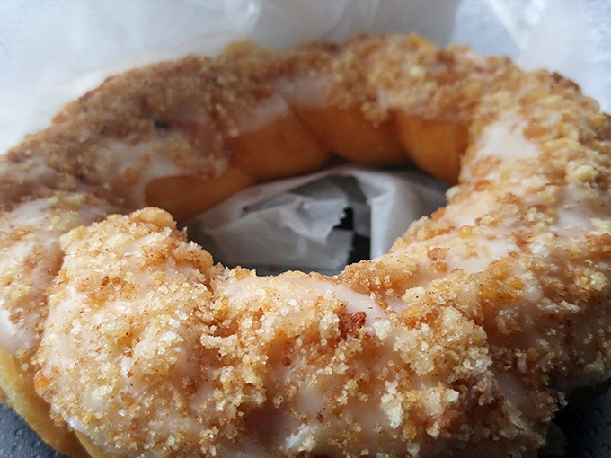 Behold the buttermilk donut in all its glory—that perfect glaze catching the light like nature's way of saying "calories don't count when they're this artisanal."