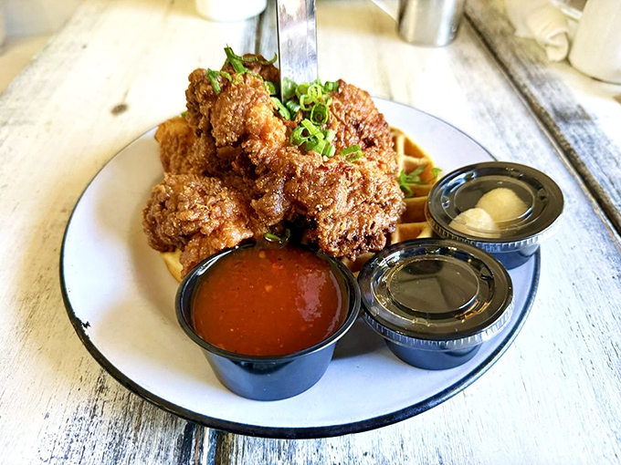 Buttermilk fried chicken perched on a waffle like it's posing for its own cooking show debut episode.