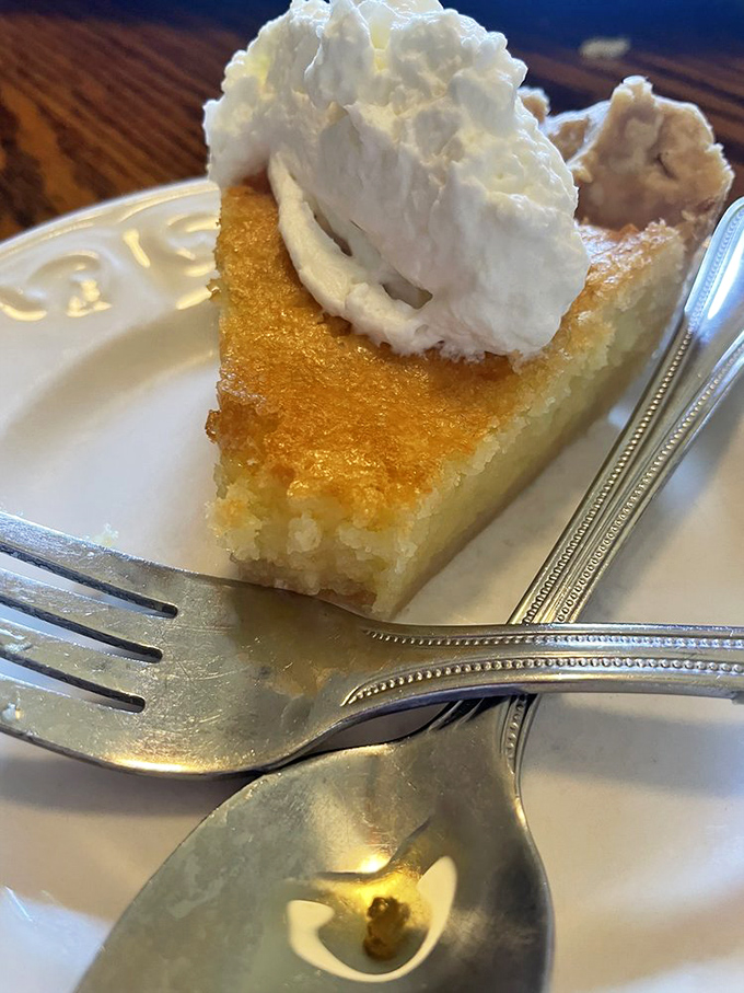 Buttermilk pie with a golden top and whipped cream crown&mdash;dessert royalty that makes you understand why Southerners guard their family recipes like Fort Knox.