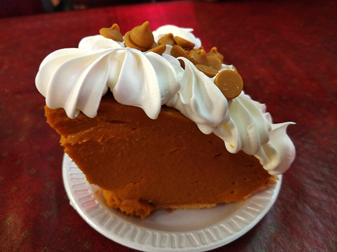 This butterscotch pie isn't just dessert; it's an amber-hued masterpiece topped with whipped cream and butterscotch chips that whisper "resistance is futile."