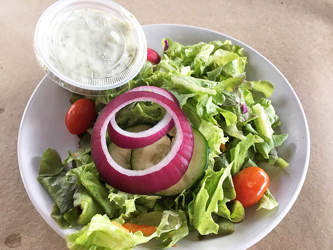 Even the salad gets special treatment at Harris. Fresh greens, vibrant veggies, and those perfect rings of red onion provide a crisp counterpoint to all that seafood.