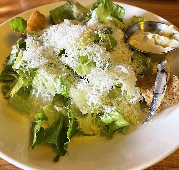 A Caesar salad that Julius himself would approve &ndash; crisp romaine wearing a cloud of freshly shaved cheese like nature's finest crown.