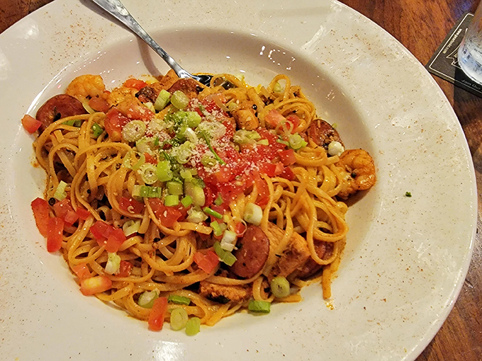 Pasta that's having an identity crisis in the best possible way&mdash;part Cajun, part Italian, and entirely delicious. Those green onions add the perfect pop of color.