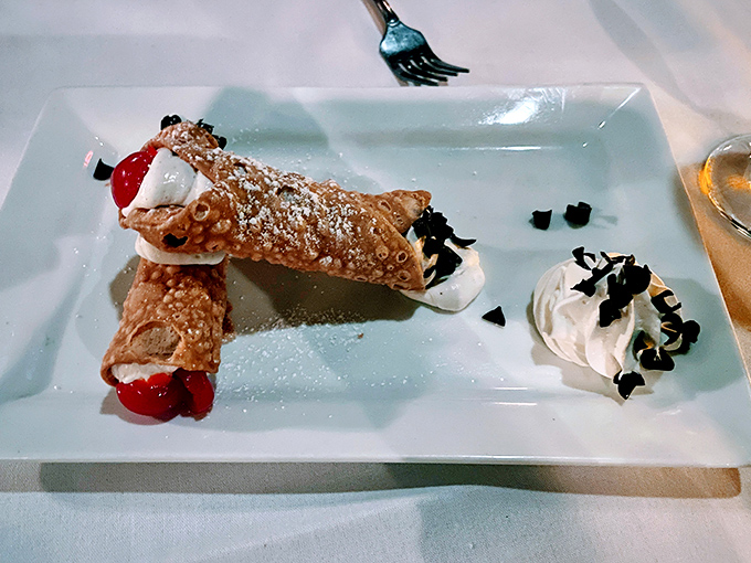 Cannoli so authentic they should come with their own passport&mdash;crisp shells, sweet ricotta filling, and those cherries adding a pop of color and flavor.