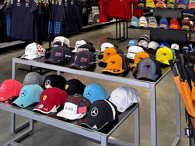 A rainbow of team loyalty on display. These branded caps let you support Mercedes or Ferrari without spending like you own the racing team.