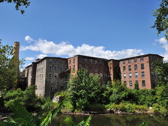 Former textile mills now stand as architectural time capsules along the riverbank, their sturdy walls holding stories of Putnam's industrious past.