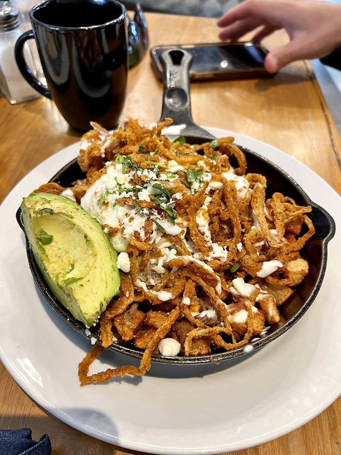 This isn't just hash—it's a skillet symphony. Crispy potatoes, perfectly cooked eggs, and a biscuit that deserves its own fan club.