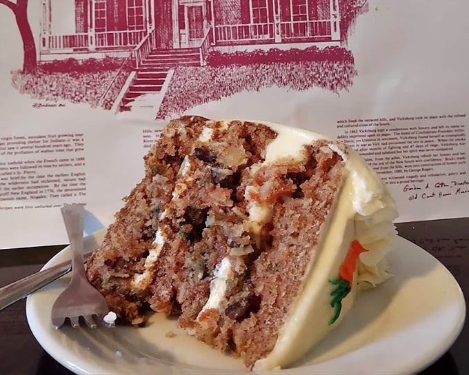 Layer upon layer of what looks like carrot cake goodness—the kind of dessert that makes you consider skipping the main course entirely next time.