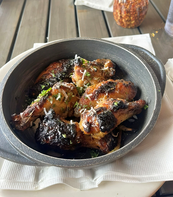 Wood-fired chicken wings that make you question everything you thought you knew about pizza joint appetizers.