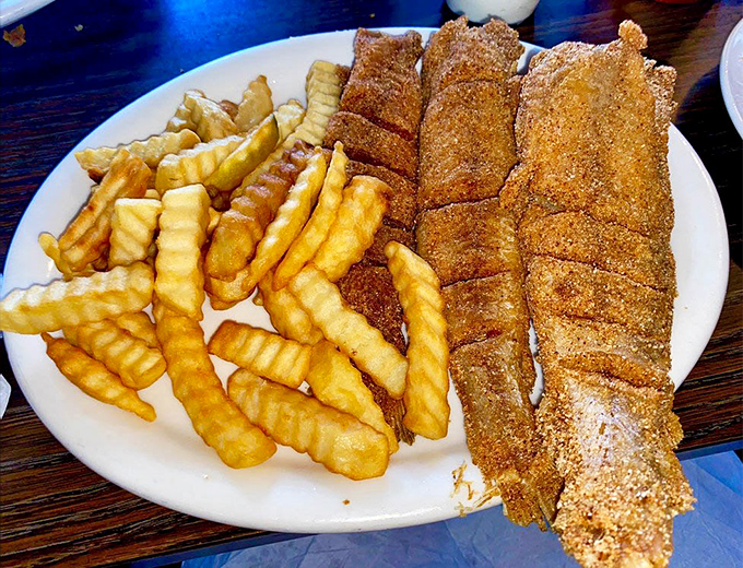 Crispy catfish fillets with crinkle-cut fries&mdash;proof that sometimes the simplest combinations make for the most memorable meals.