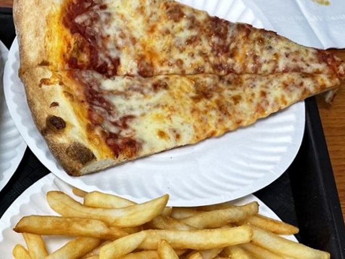 Sometimes simplicity is the ultimate sophistication. This cheese slice has that perfect fold-and-go structure that defines proper Philly pizza.