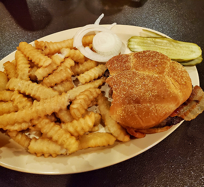 A burger that doesn't need Instagram filters or fancy toppings—just honest-to-goodness flavor with a mountain of those legendary crinkle fries.