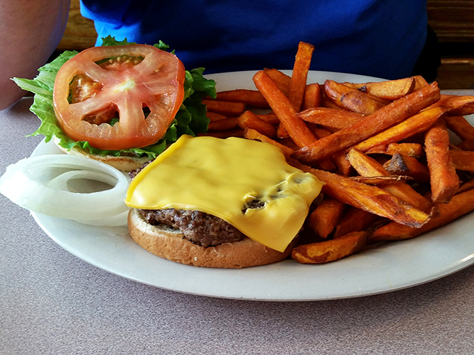 The cheeseburger that launched a thousand road trips, with sweet potato fries that deserve their own fan club.