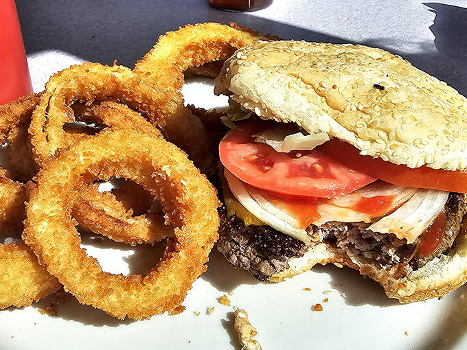 A proper diner burger comes with proper onion rings—crispy, golden halos that make fast food versions hang their heads in shame.