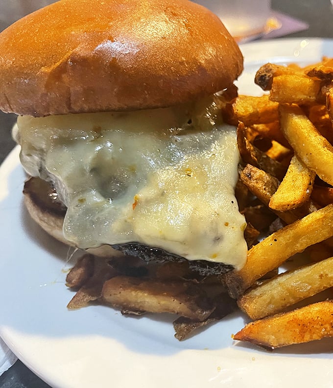 This isn't just a cheeseburger; it's a masterclass in American comfort food, with fries that look like they were hand-cut by angels.
