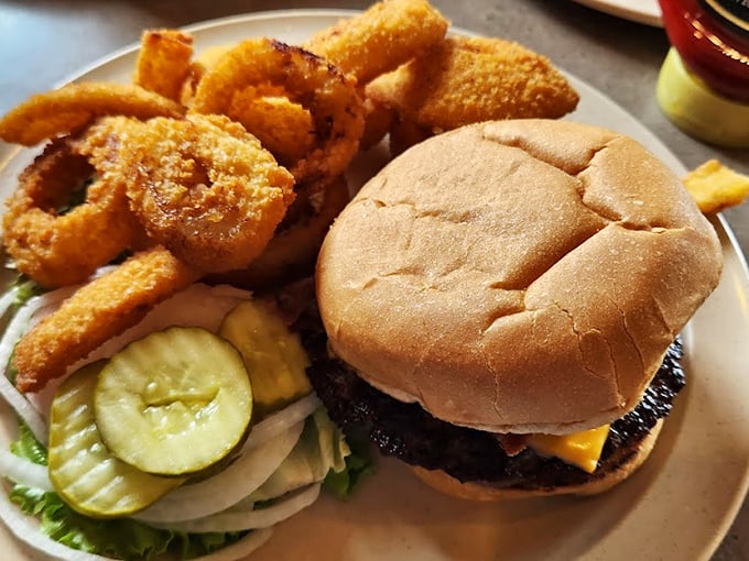 A classic cheeseburger with onion rings that proves sometimes the simplest pleasures are the most satisfying. No food influencer filters needed here.