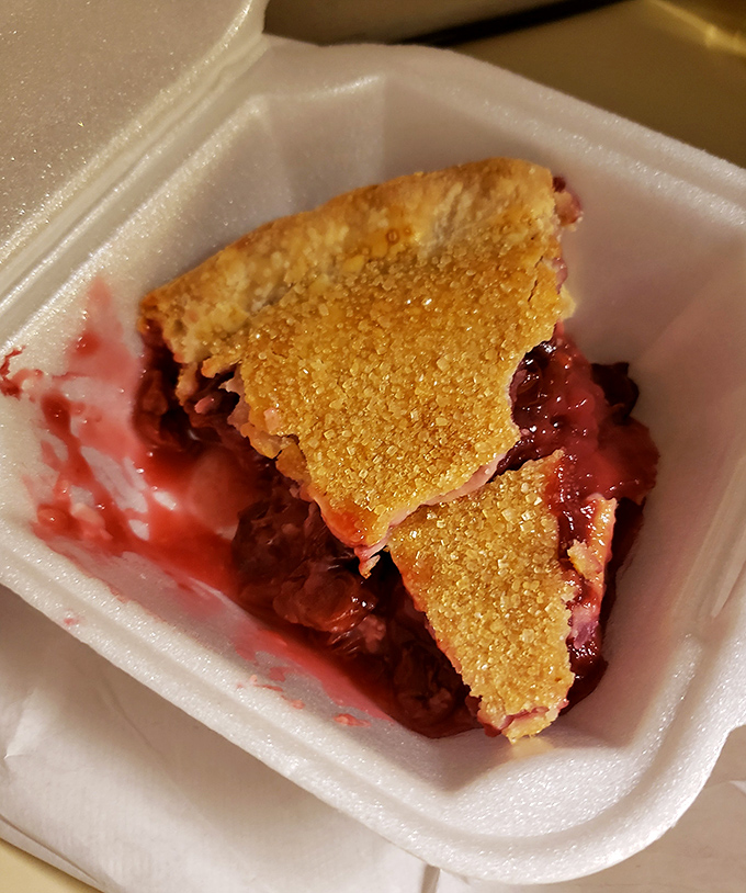 This cherry pie isn't just dessert; it's Door County sunshine captured in a crust that shatters with delightful precision.