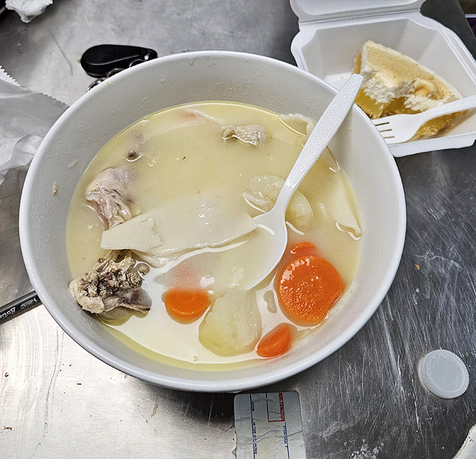 Chicken soup that could heal not just colds but existential crises, with tender chunks of meat and vegetables swimming in liquid comfort.