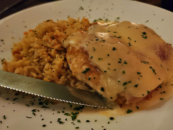 Chicken Cordon Bleu with its melty cheese waterfall and rice pilaf sidekick&mdash;comfort food that graduated from culinary finishing school.