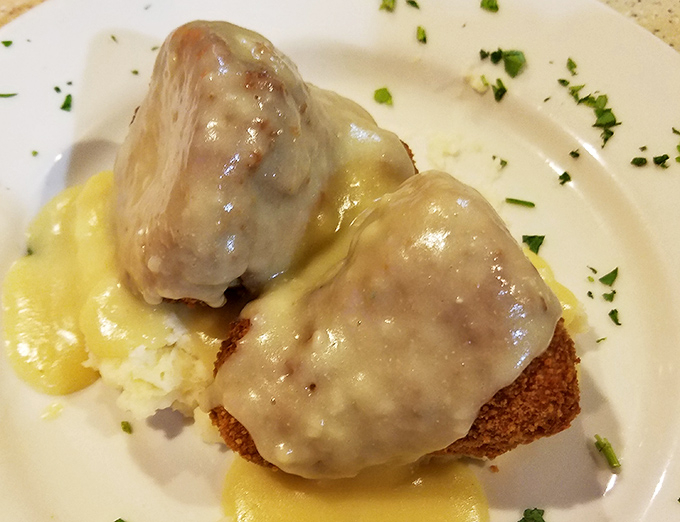 Chicken croquettes – the comfort food your grandmother would approve of, swimming in gravy that could make cardboard taste magnificent.