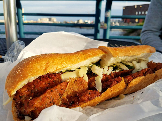 This chicken cutlet sandwich isn't just lunch &ndash; it's edible architecture, with layers of crispy goodness nestled in that perfect roll.