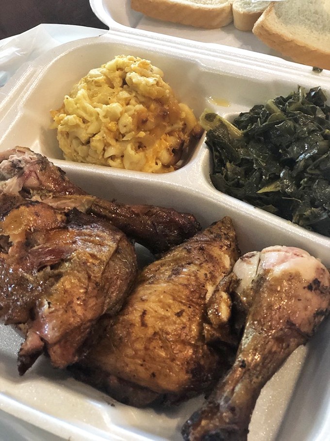 Southern comfort on a plate: golden chicken, mac and cheese, and greens. The holy trinity of soul-satisfying goodness.