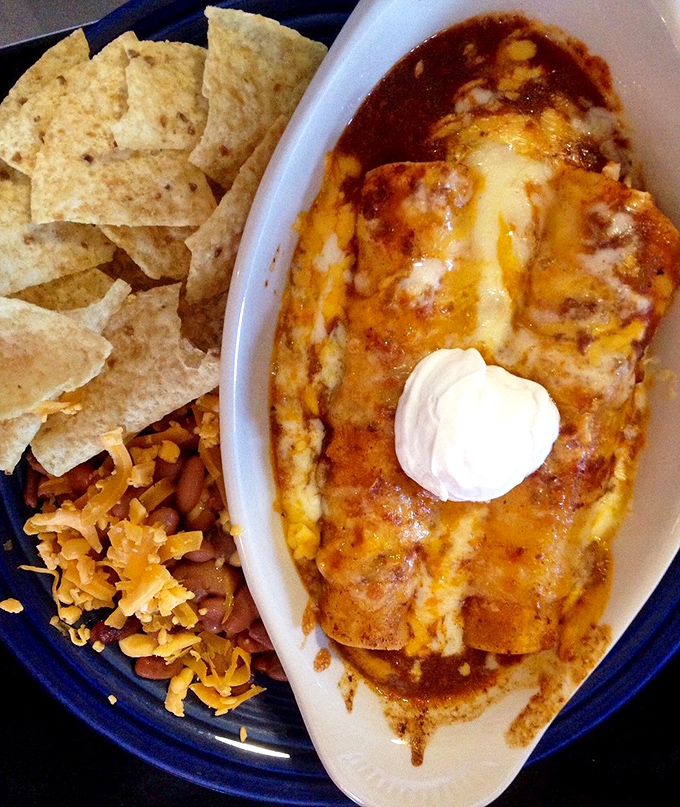 These enchiladas aren't just covered in cheese&mdash;they're wearing a melty security blanket that makes Monday blues disappear faster than dessert at a family reunion.
