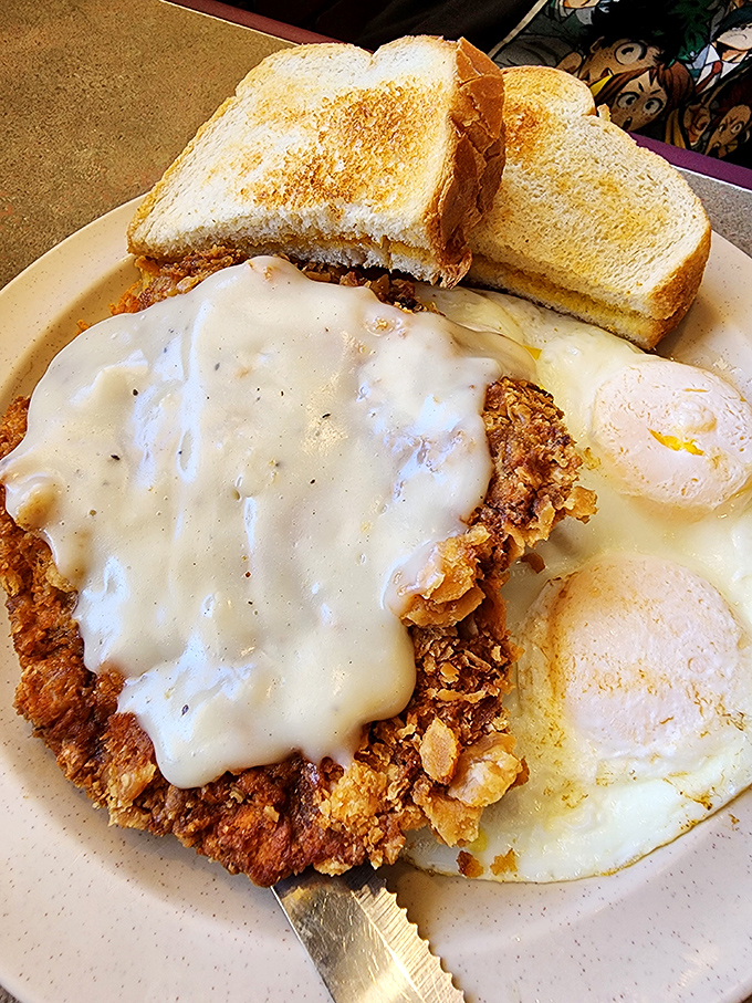 Chicken fried steak smothered in country gravy with eggs sunny-side up. Not diet food, but definitely worth the extra mile on tomorrow's run.